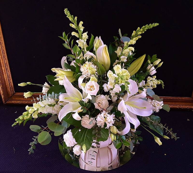 Peaceful White Lilies Basket arranged by a florist in Ravenna, OH ...